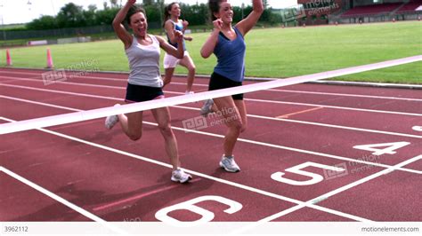 athletes running towards finish line stock video footage 3962112