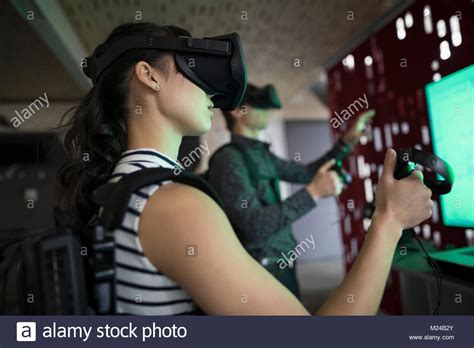 computer programmers testing virtual reality simulator glasses and