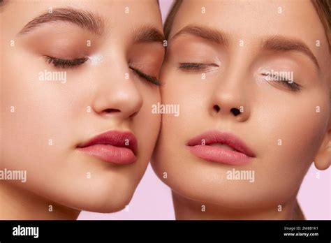 Tender Naturality Portrait Of Two Young Beautiful Girls With Well