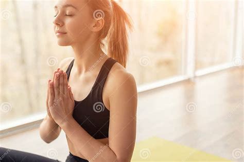 Woman Meditating With Closed Eyes In Bright Light Stock Image Image