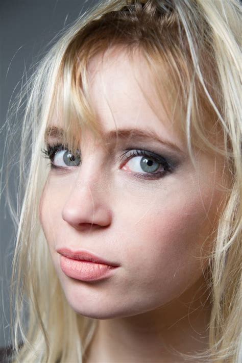 Beautiful Blue Eyes Blonde Looking At Camera Indoors Stock Image