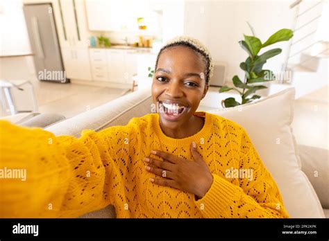 Cheerful African American Young Woman Screaming And Gesturing While