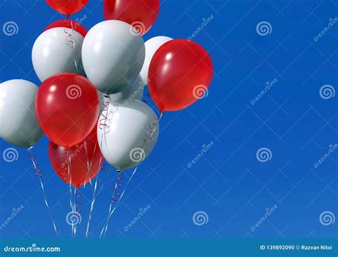 Group Of Helium Balloons With Ribbons On Blue Sky Background Stock