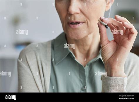 Close Up Of Unrecognizable Mature Woman Smoking Cigarette At Home For