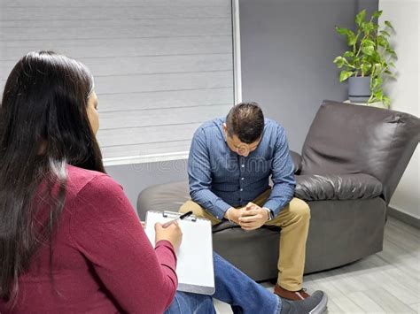 Female Psychologist Or Psychiatrist Gives Therapy To Her Dark Skinned