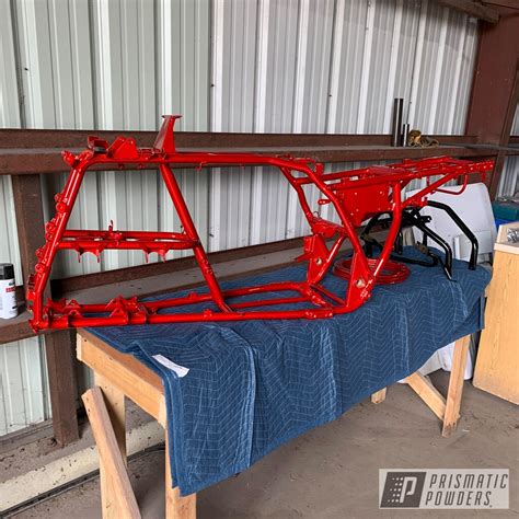 Atv Frame Coated With A Gloss White And Soft Red Candy Finish