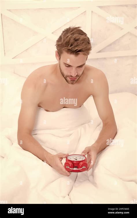 Man Waking Up Early Morning Ringing Alarm Clock Set Up Clock Concept
