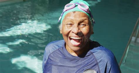 Video Of Happy Senior African American Women Swimming In Pool Stock