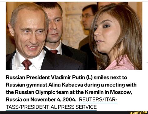Russian President Viadimir Putin L Smiles Next To Russian Gymnast