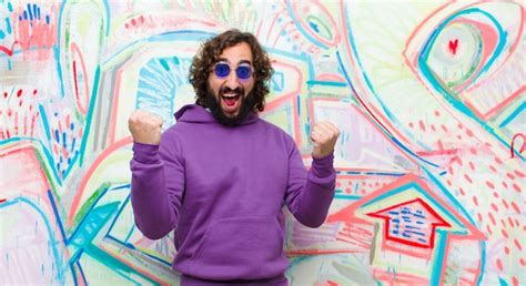 Premium Photo Young Bearded Crazy Man Feeling Happy Surprised And
