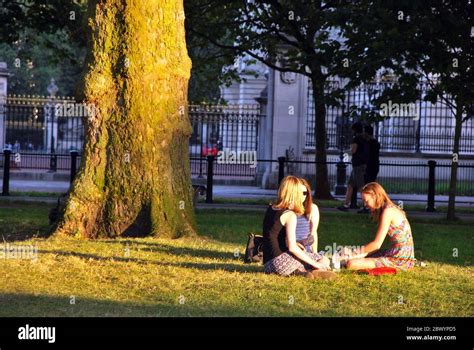 Young Women Enjoying An Afternoon In The Park In A Sunny Day Stock