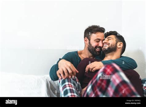 Happy Gay Couple Having Tender Moments In Bedroom Homosexual Love