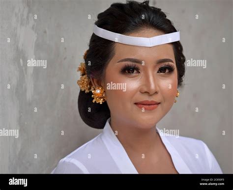 Beautiful Indonesian Balinese Woman Wears White Outfit And Poses For