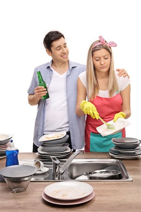 Man With Beer Hugging His Wife Doing The Dishes Stock Image Image Of