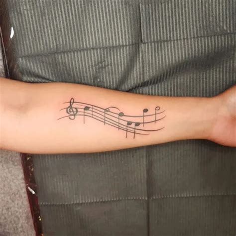 56 Melodiously Meaningful Music Note Tattoo Ideas for 2025!
