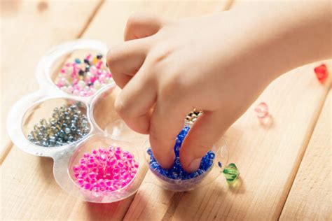 Why Threading Beads Is Important in Preschool - Empowered Parents