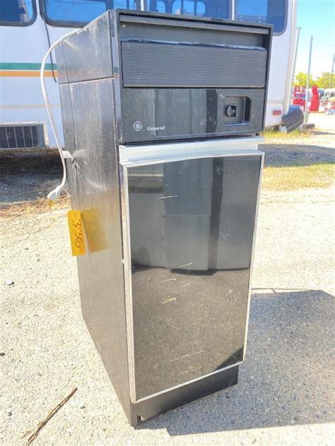 Image result for GE Compact All Trash Compactor How to Load Bag