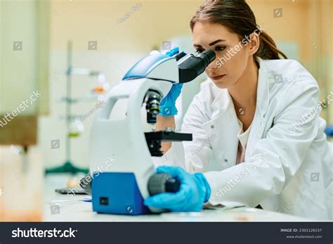 Image result for Looking through Microscope