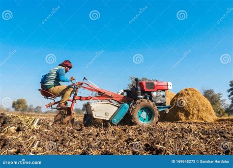 Image result for Indian Man Using Soil Compaction Machine