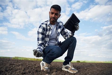 Image result for Indian Man Using Soil Compaction Machine