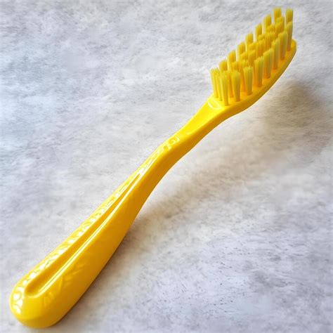 Image result for Yellow Toothbrush