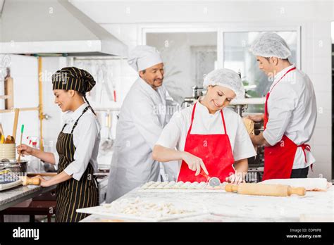 Chefs Preparing Pasta In Kitchen Stock Photo - Alamy