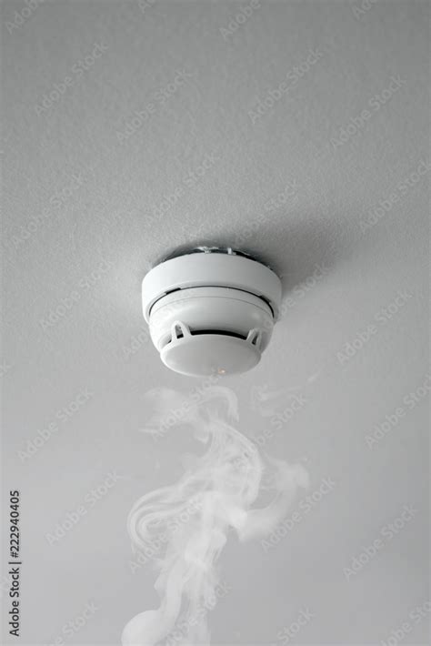 Smoke detector of fire alarm in action Stock Photo | Adobe Stock