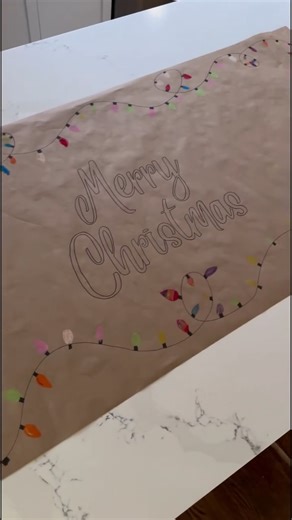 Cindy | Life + DIYs on Instagram: "Festive Table Runner Idea This turned out so cute and I loved how the kids were able to get involved! Just make sure you don’t place food directly on top of the colored sections 😉 #christmashostingideas #hosting #holidayhosting"