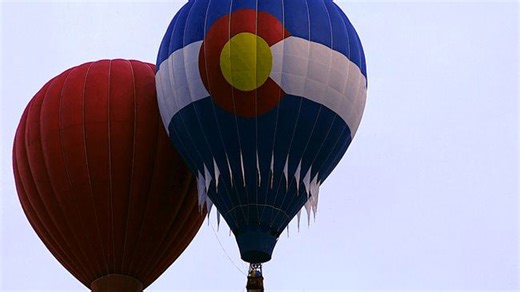 Massive US Flag Suspended from Hot Air Balloons in 'Patriotic Display'