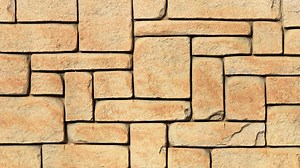 Masonry stone cladding wall texture seamless loop. Geometric shapes surface background.