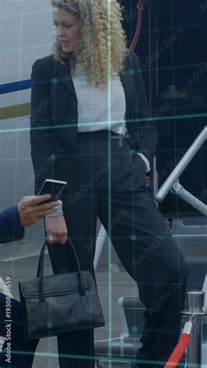 Vertical video: Woman pausing on jet steps while man holding phone, grid overlay confirming travel