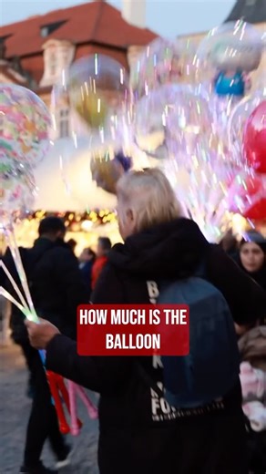 Honest Guide on Instagram: "Using charity as a shield to sell flashy baloons to tourists - welcome to Prague"