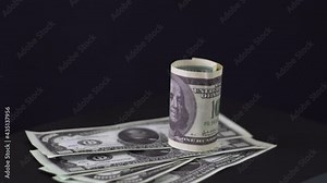 American dollars. Banknotes. 1000 dollars. Benefit. Money on a black background. Securities. Taxes. Rotation of money. Dividends. Sale. The cost of goods. Money machine. New money. Old money. Close-up