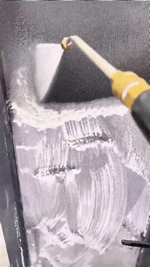 Foam swirls under pressure—mesh screen sheds grime in a dance of water and light
