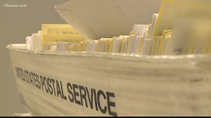 Why are some Georgia voters getting absentee ballots they didn't request, and what should they do with them?