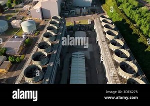 Aerial drone view of huge power plant, electrical energy generation, chimneys and turbines and trainlines, coal fired in Little Barford, United Kingdom Stock Video Footage - Alamy