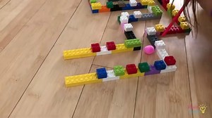 Blow Pom Poms Through a LEGO Maze Activity