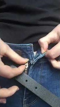 Buttoning and unbuttoning tight blue jeans and unbuckling black belt #7