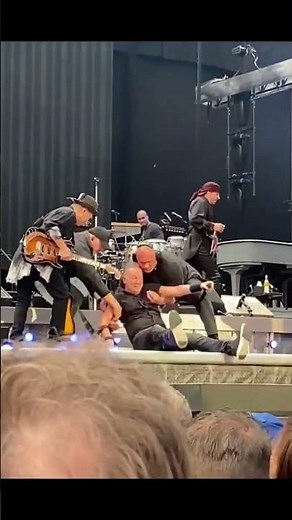 Bruce Springsteen trips and falls on stage