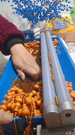 Sorting Orange Beads with Precision in a Creative Workspace