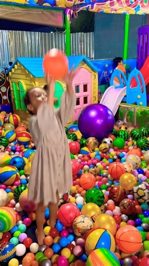 Throwing orange basketball in the mini yellow house and colorful ball pool. Fun & cheerful. #shorts