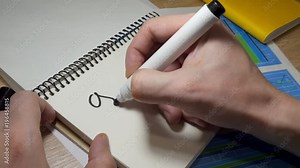 Man writing goal setting at note. Business management.