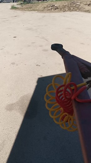 Exploring Red and Yellow Hose Clamp on Metal Pipe