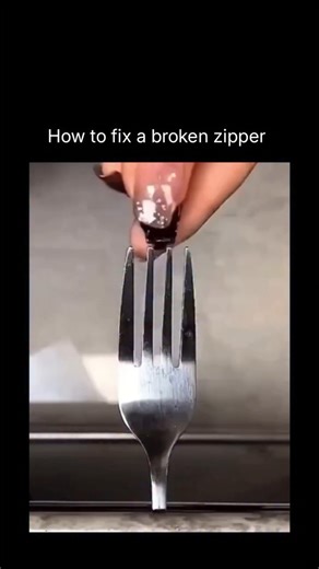 Uncut USA on Instagram: "This clip demonstrates a simple mechanical fix for a detached zipper slider using an everyday tool. By using the prongs of a fork to stabilize the slider, both sides of the zipper tape can be reinserted and aligned before pulling the mechanism back into position. The method works because the fork acts as a temporary guide, keeping the geometry of the slider consistent while the interlocking teeth are re-engaged. It restores function without replacing the zipper or damagi