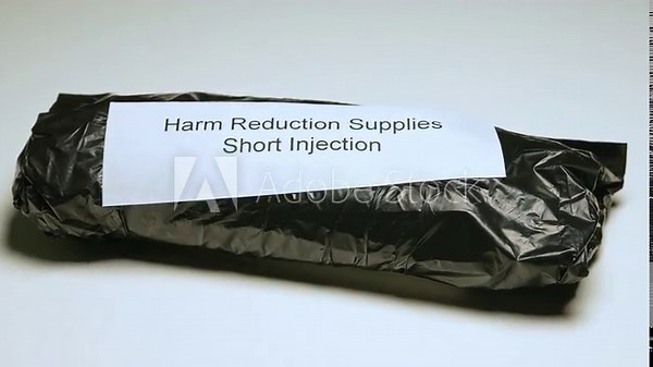 Harm Reduction supplies kit provided by government program for safe consumption of drugs. Short Injection package contain needles, sterile water with cooker and sterile filter and more.
