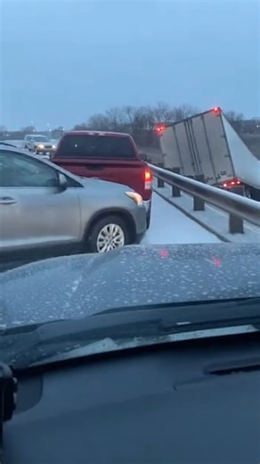 Icy Ramp Pileup Traps Helpless Drivers Indianapolis, Indiana — February 3, 2025 An icy highway ramp turned into a demolition derby Monday evening as a chain-reaction crash was caught on camera, showing just how quickly winter conditions can lead to chaos. The video starts with a semi-truck already jackknifed across the entire overpass. A driver filming the scene exclaims, "Oh no! The trailer's across the whole ramp!" as a silver SUV approaching the wreck slams on its brakes. Instantly, the SUV l