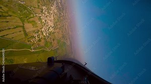 Fighter jet 360 degree rotation and low passing in the sky,deep ground view, slow mo, captured from go pro cockpit cam, front view