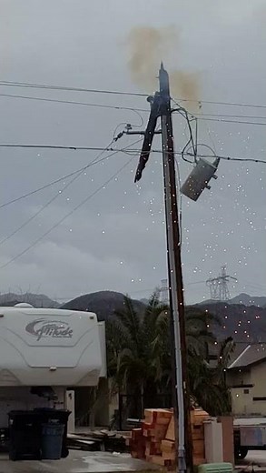 Power pole burning and breaking off