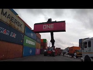 Kalmar Reach stacker with a tilting spreader for container handling.