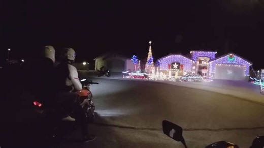 Holiday light tour on bikes searching for most impressive neighborhood decorations